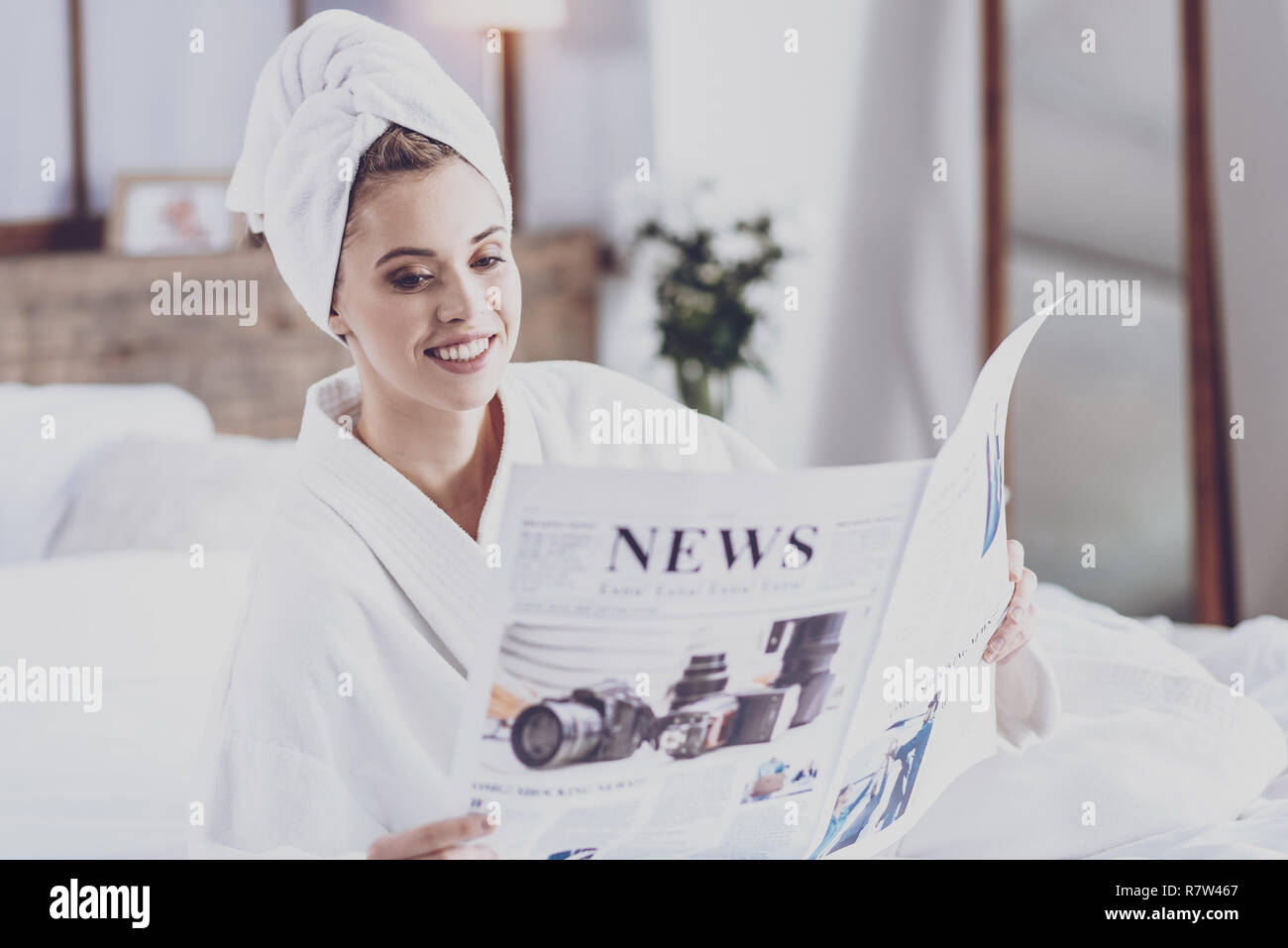 Young woman reading morning press Stock Photo - Alamy