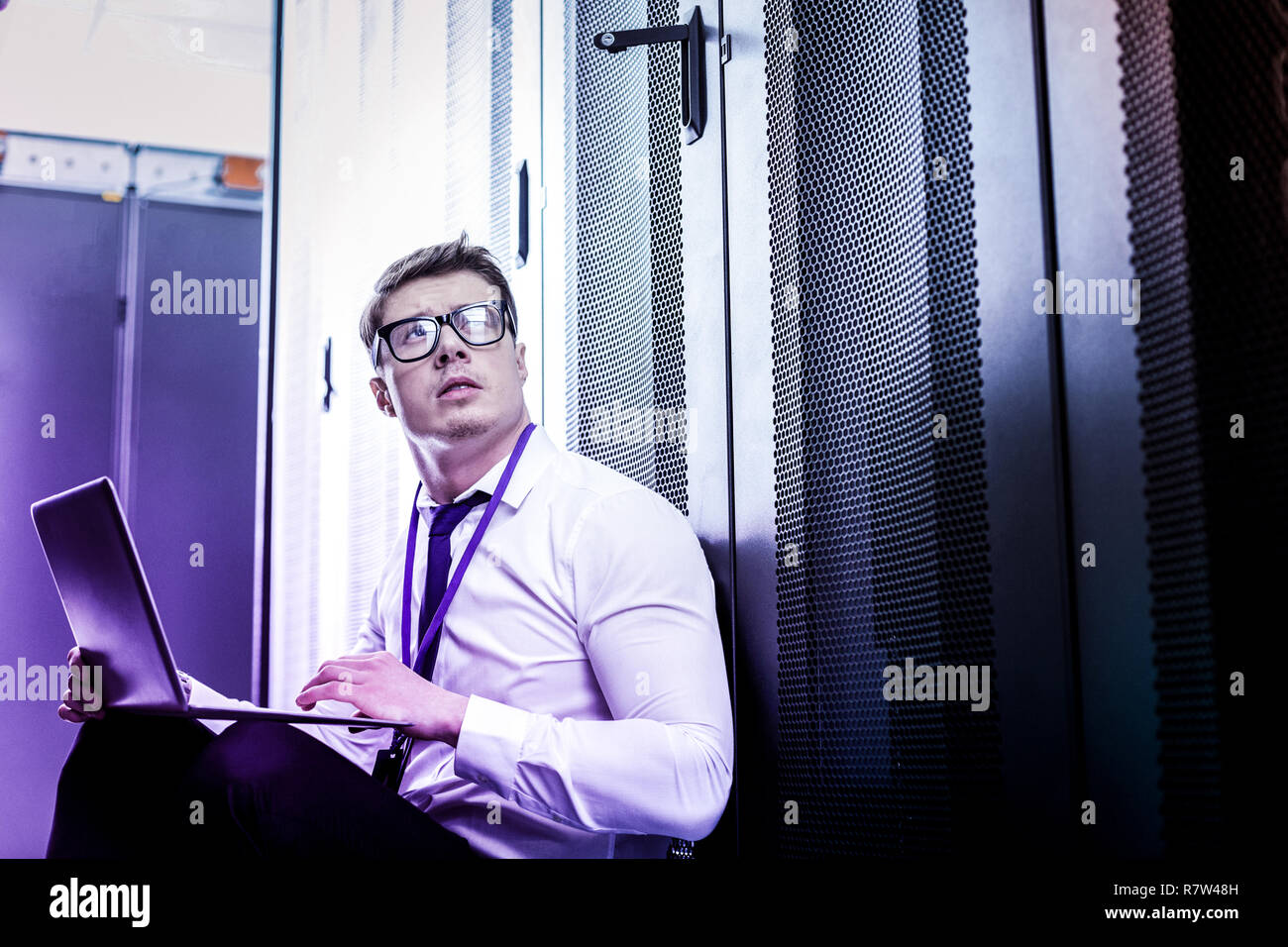 Nice professional programmer working on the laptop Stock Photo - Alamy