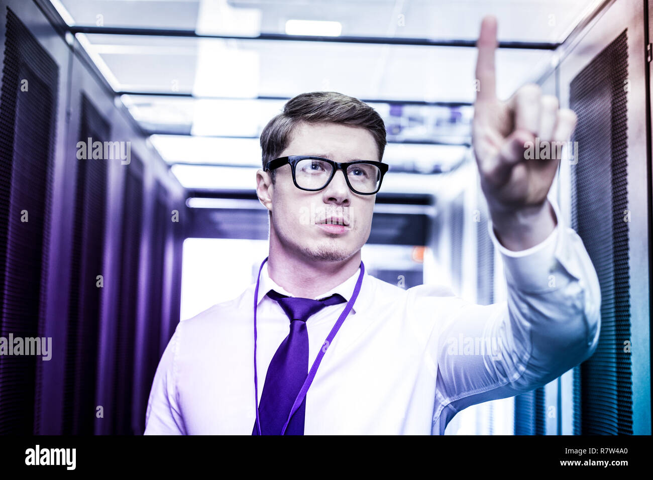 Intelligent young man looking at the screen Stock Photo - Alamy