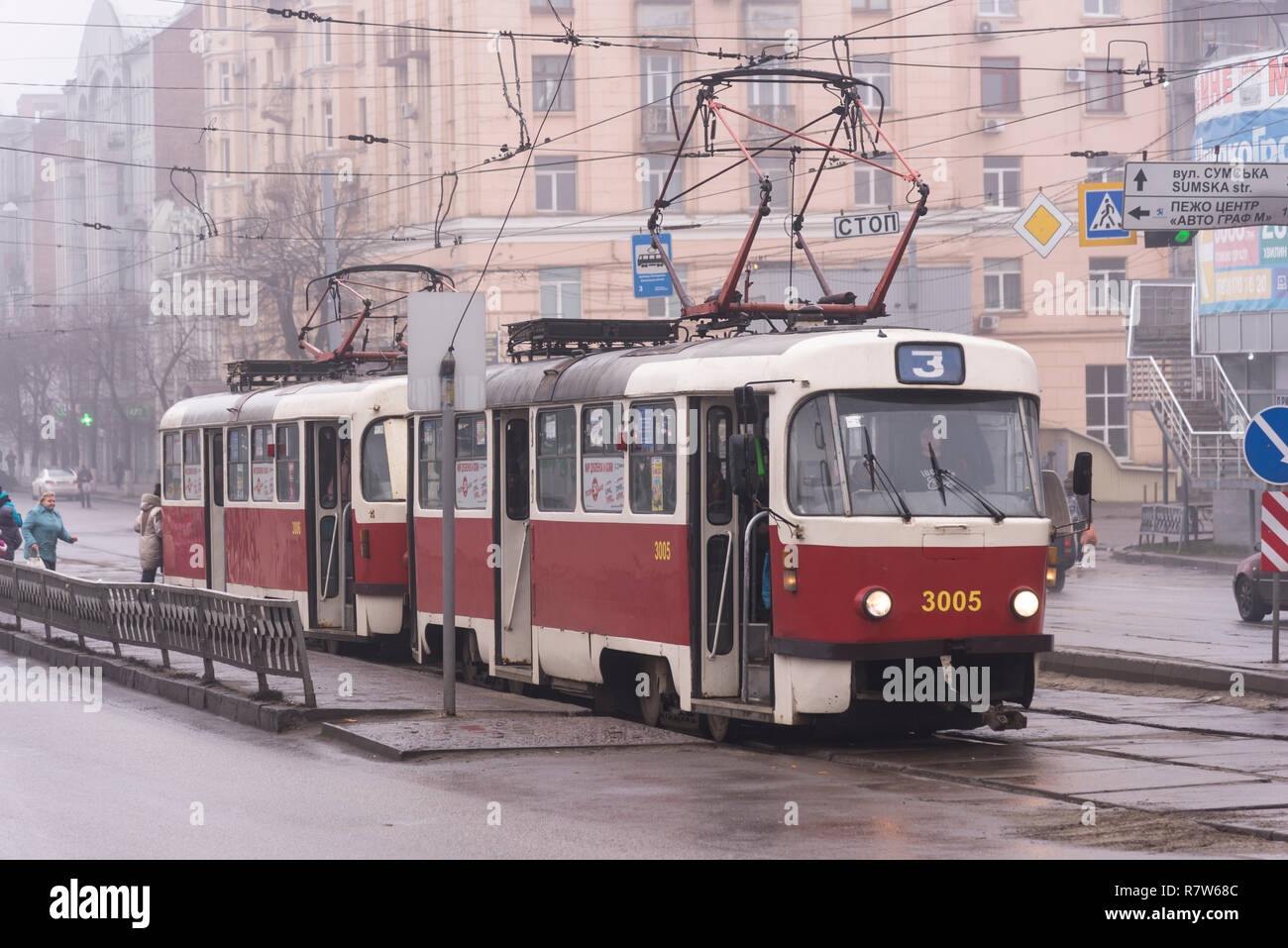 People getting on a tram hi-res stock photography and images - Alamy