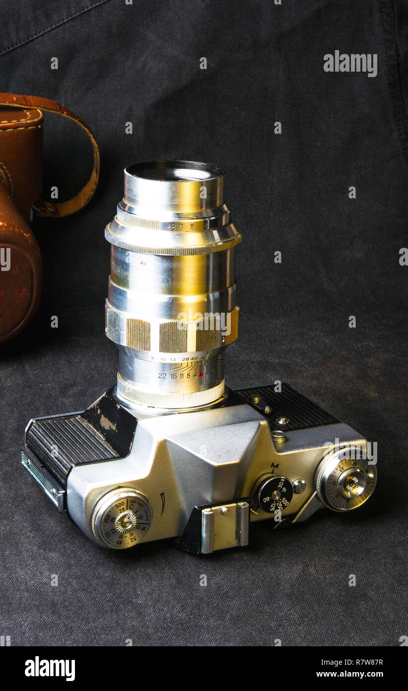 old vintage Soviet camera with leather case on black background Stock ...