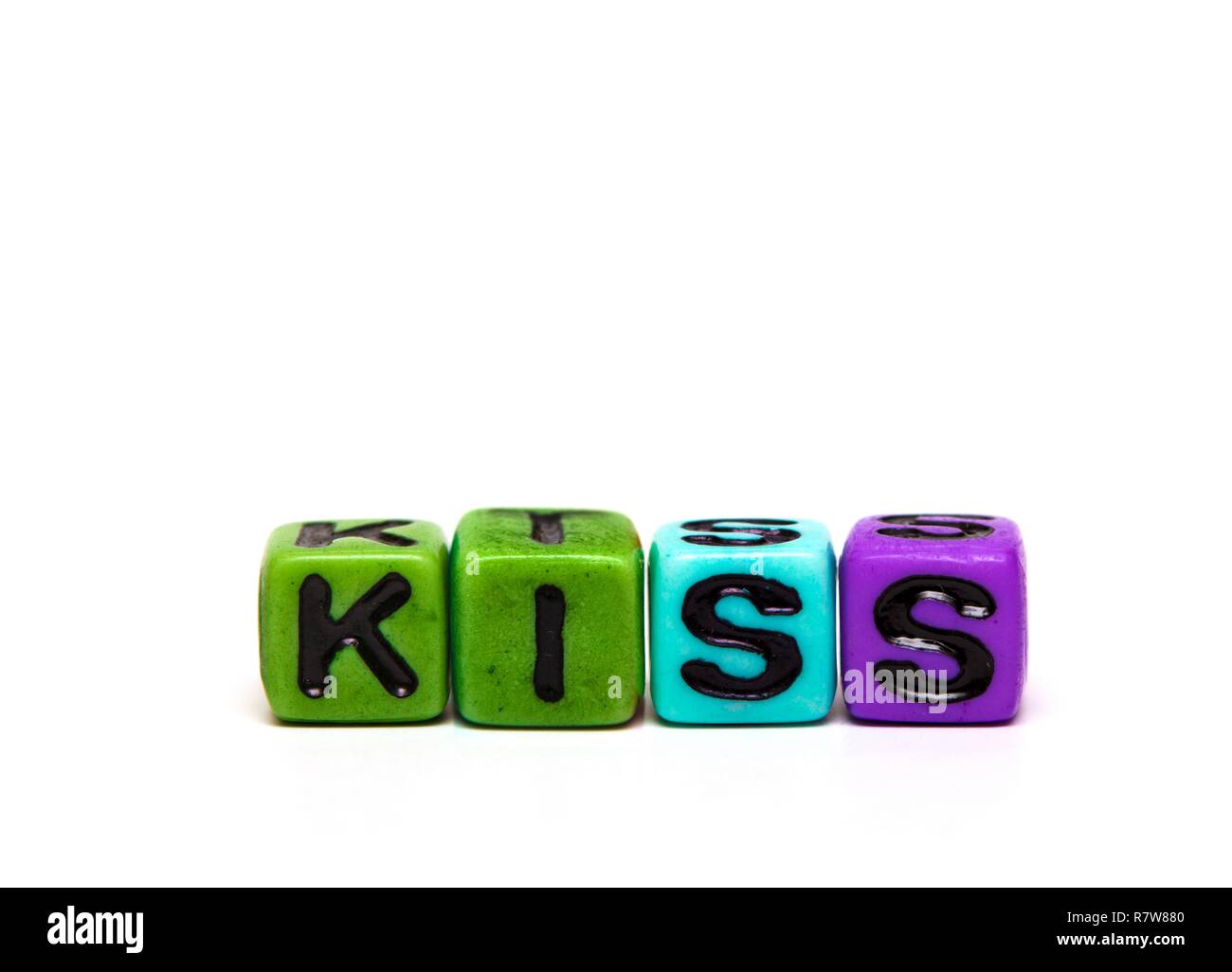 kiss - word made from multicolored child toy cubes with letters Stock ...