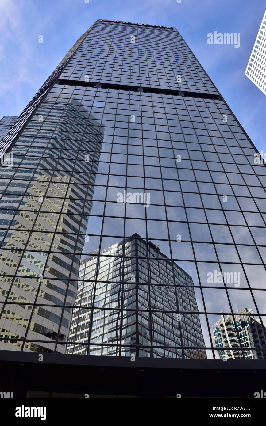 Office tower block with reflection of adjacent office block in its ...