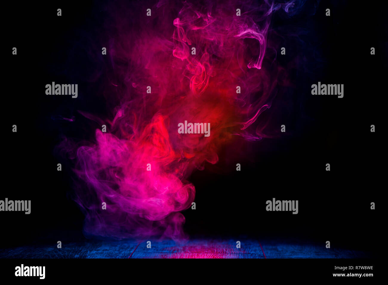 red and blue smoke patterns at dark background Stock Photo - Alamy