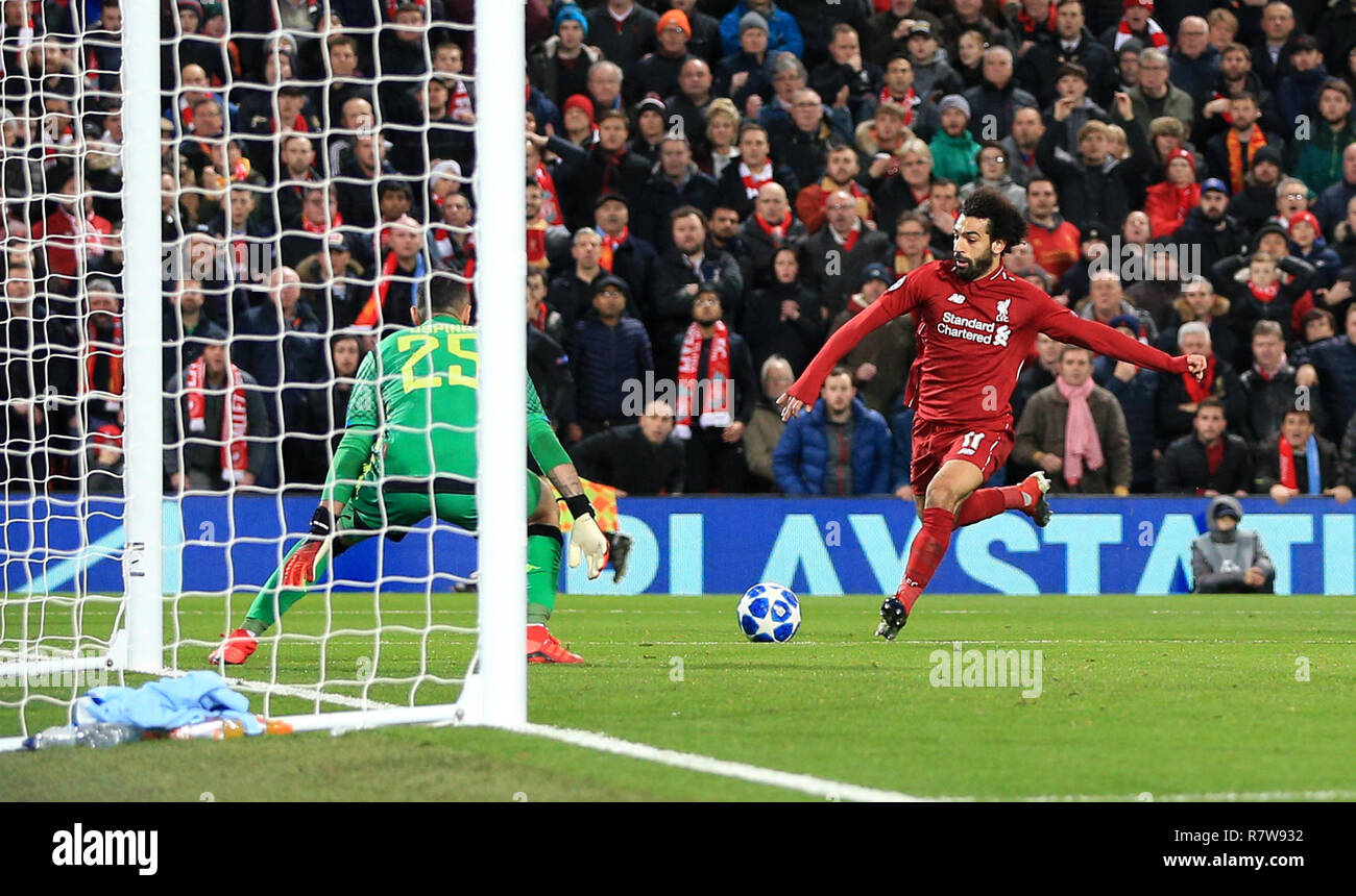 Liverpool's Mohamed Salah (right) scores his side's first goal of the ...