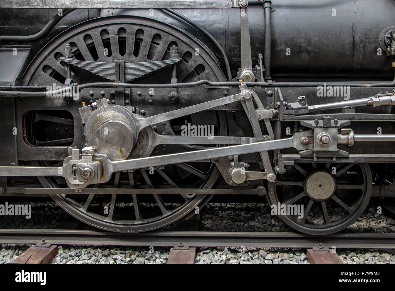 Detail of steam locomotive wheel on tracks Stock Photo - Alamy