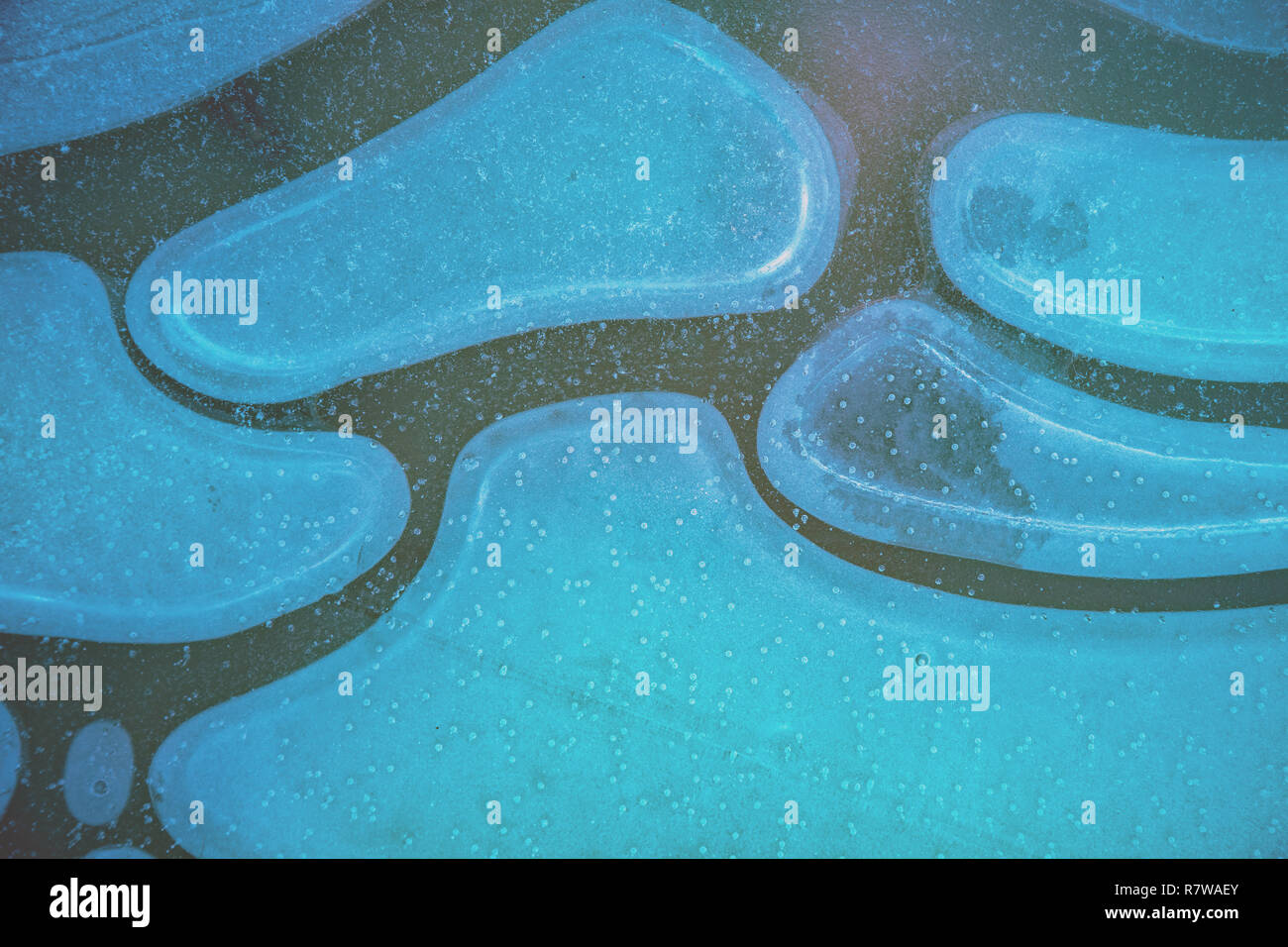 Natural abstract pattern on a frozen puddle. Nature background Stock ...