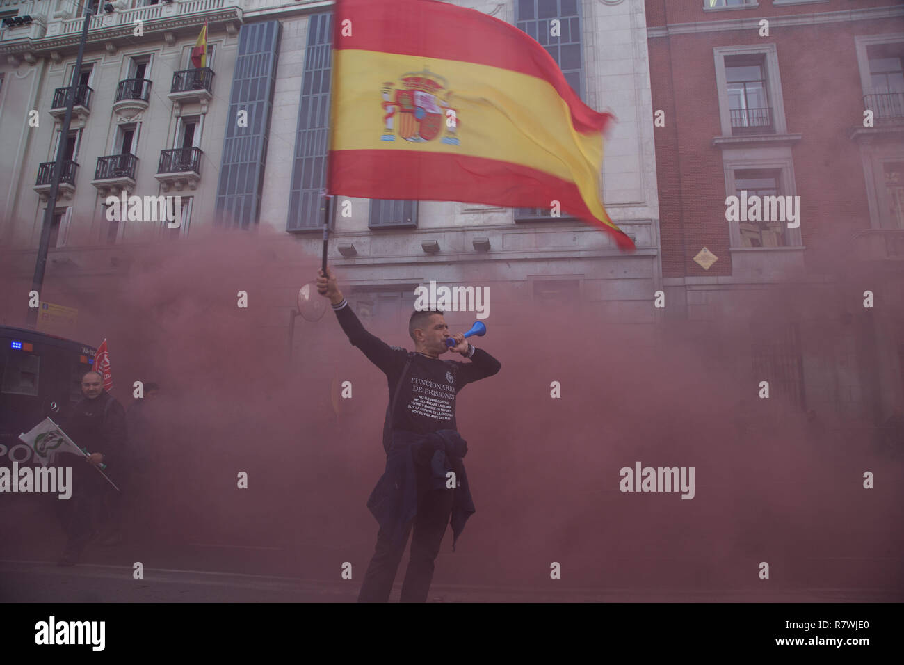 Madrid, Spain. 11th Dec, 2018. A protester seen waving a Spanish flag ...
