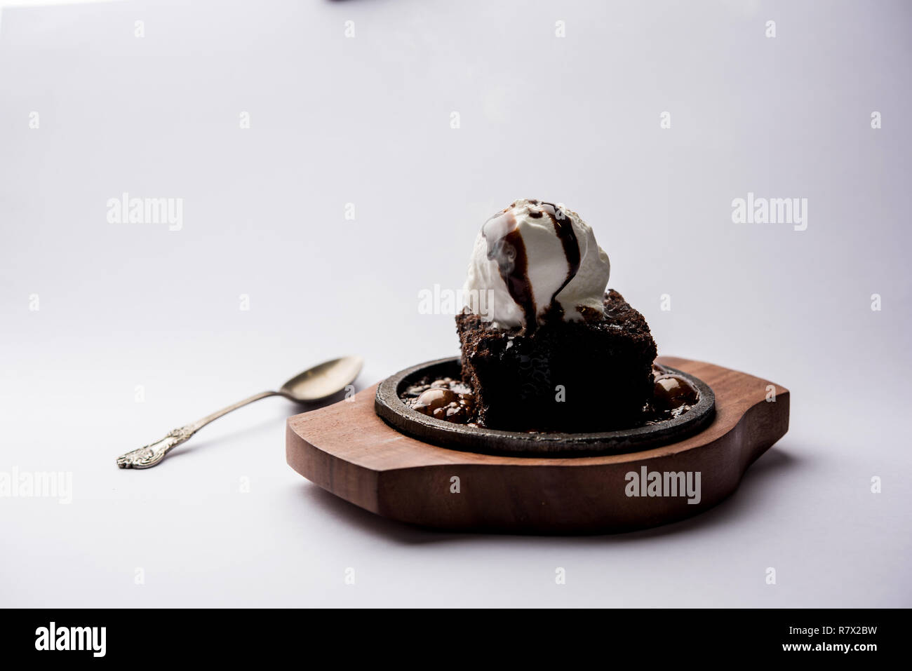 sizzling chocolate brownie is a sweet dish made using scoop of ice ...