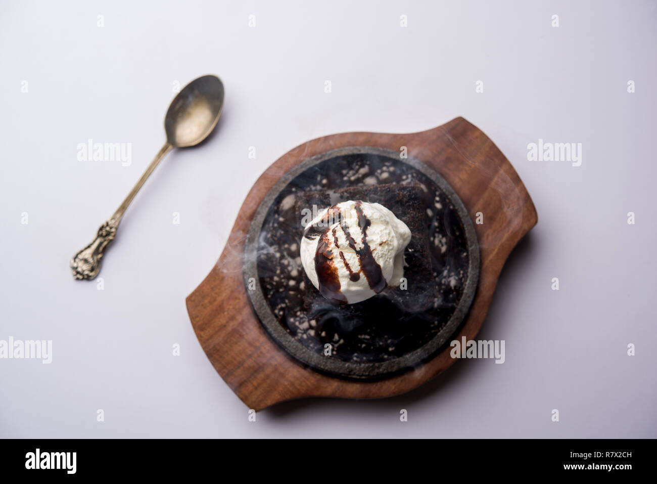 sizzling chocolate brownie is a sweet dish made using scoop of ice ...