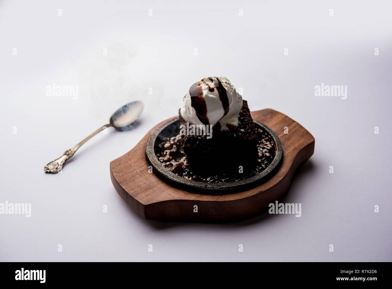 sizzling chocolate brownie is a sweet dish made using scoop of ice ...