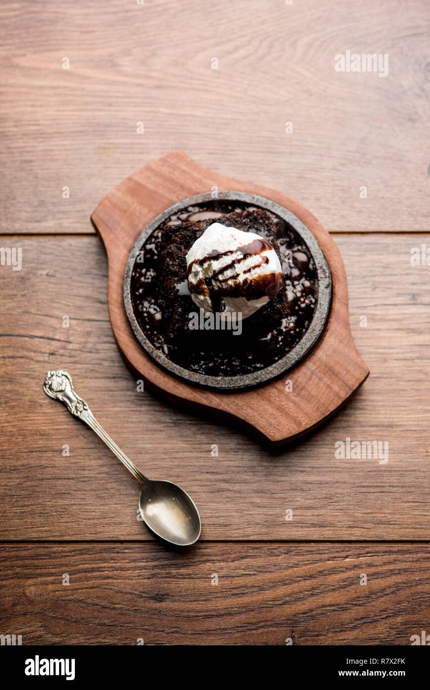 sizzling chocolate brownie is a sweet dish made using scoop of ice ...