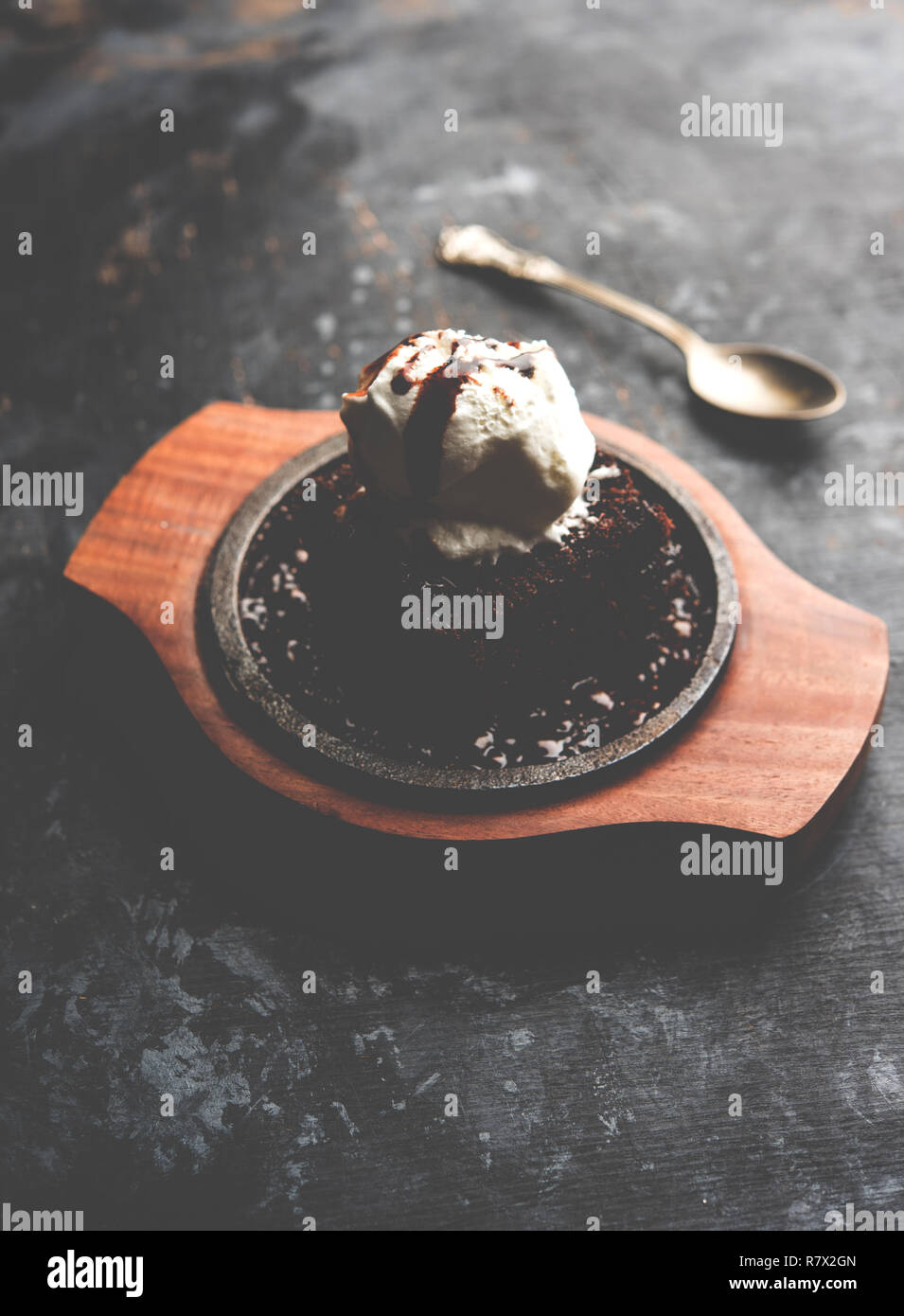 sizzling chocolate brownie is a sweet dish made using scoop of ice ...