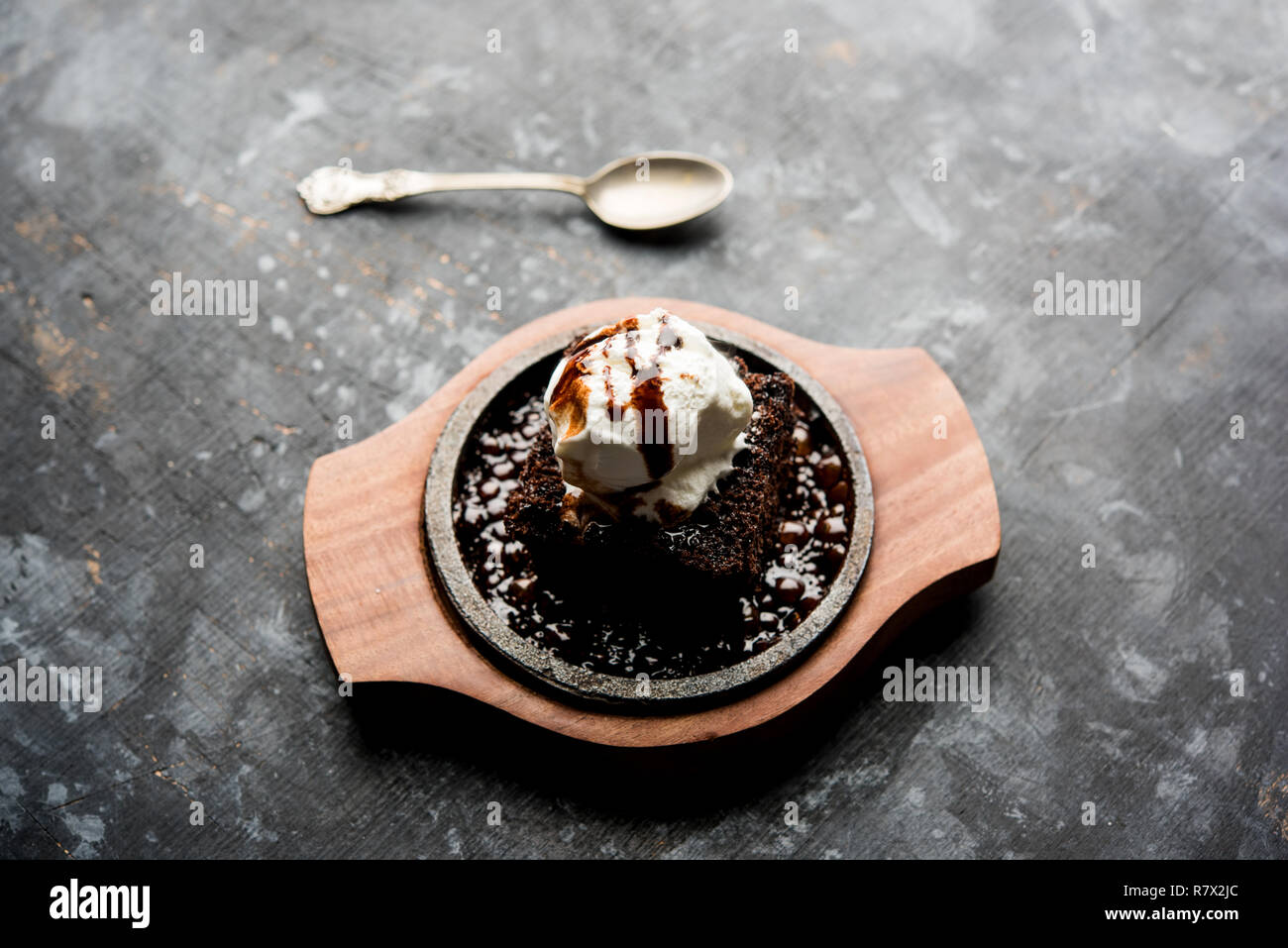 sizzling chocolate brownie is a sweet dish made using scoop of ice ...