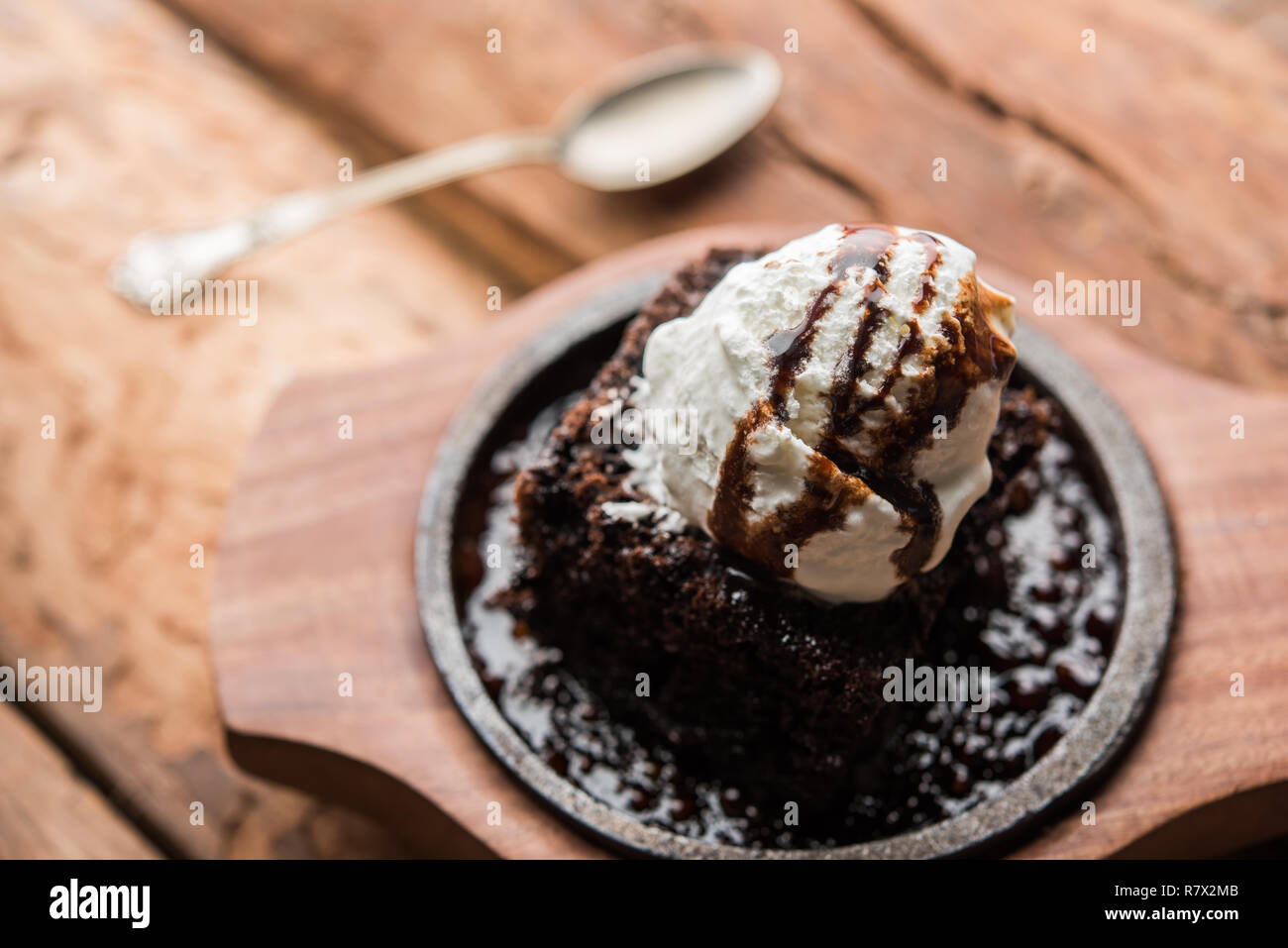 sizzling chocolate brownie is a sweet dish made using scoop of ice ...