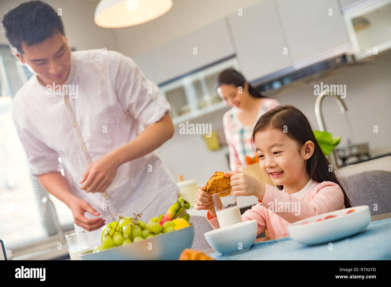Happy family was eating breakfast Stock Photo - Alamy