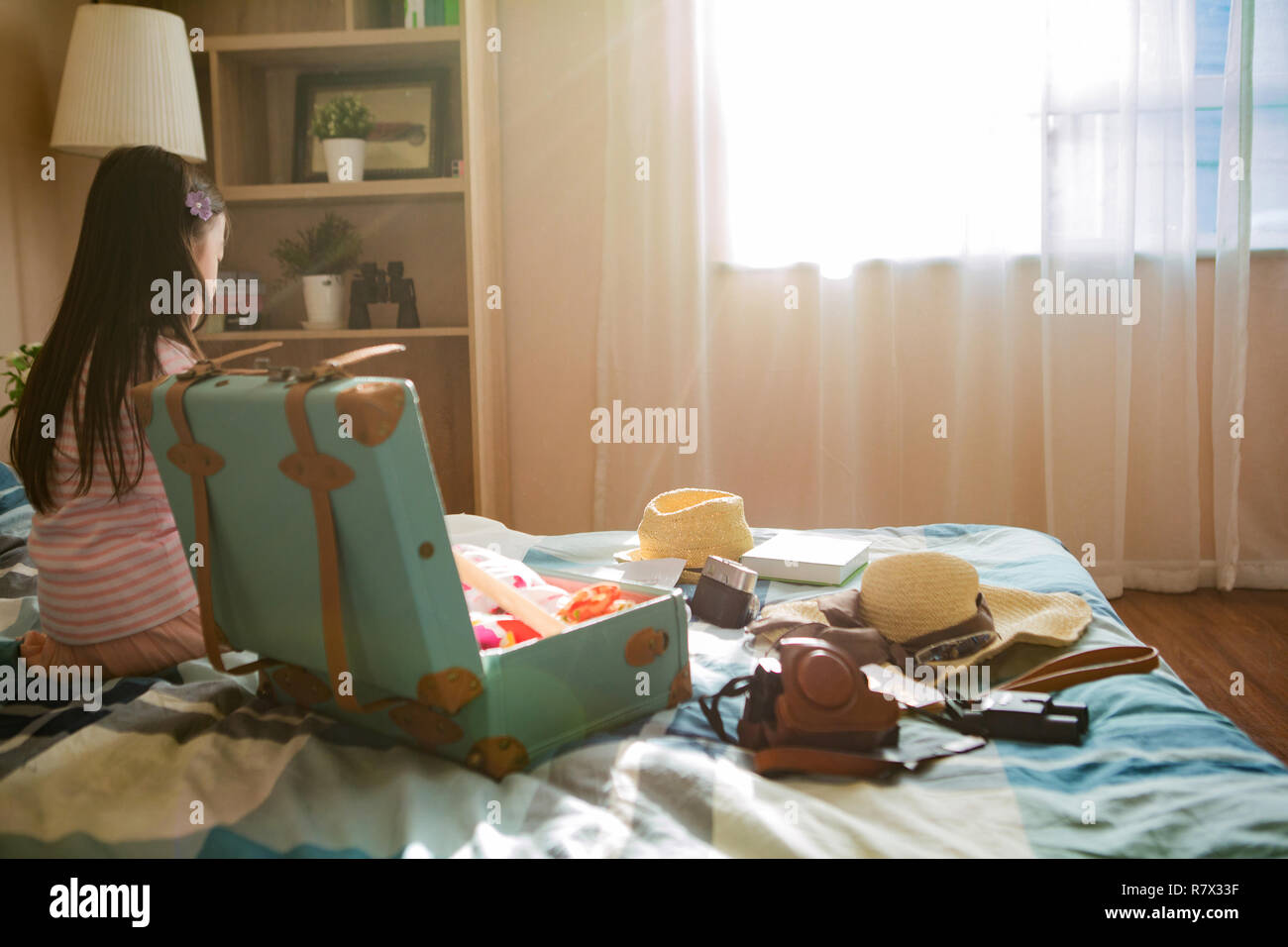 Cute girl in packing Stock Photo - Alamy