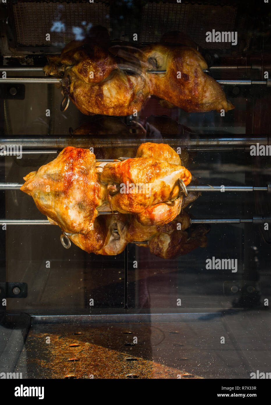 Chicken roasting on rotisserie High Resolution Stock Photography and ...
