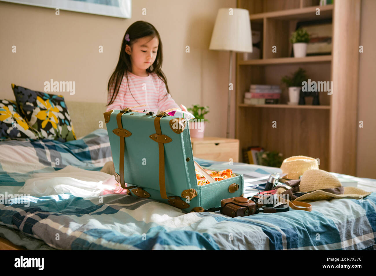 Indian girl with luggage hi-res stock photography and images - Alamy