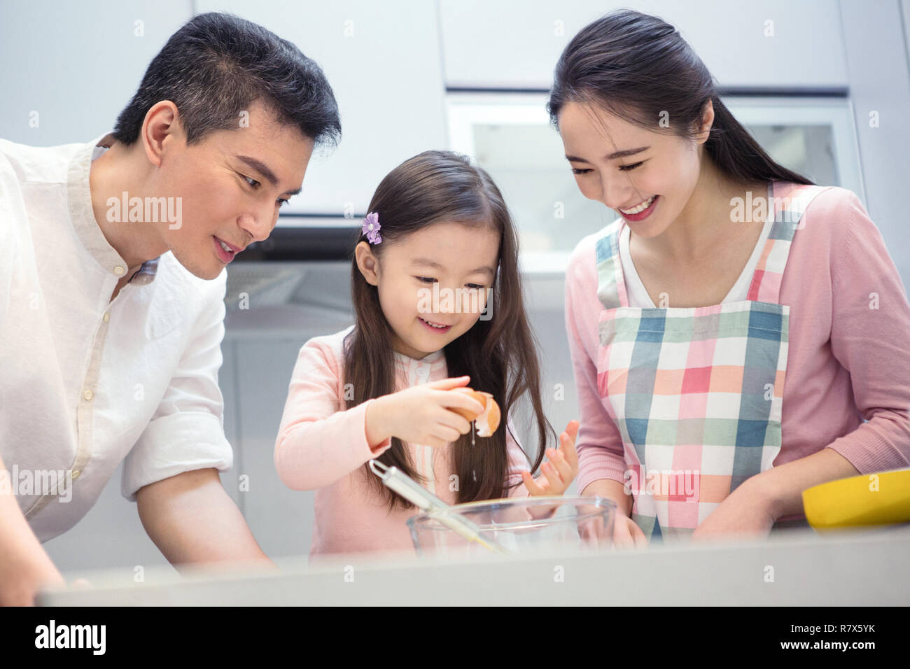 A happy family in the kitchen Stock Photo - Alamy