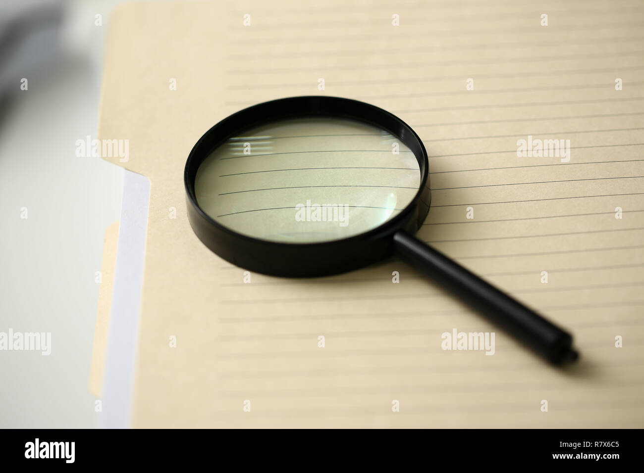 Magnifying lens on folder hi-res stock photography and images - Alamy