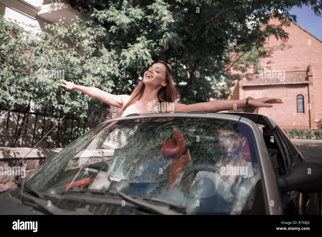 young woman enjoying the ride in the car Stock Photo - Alamy