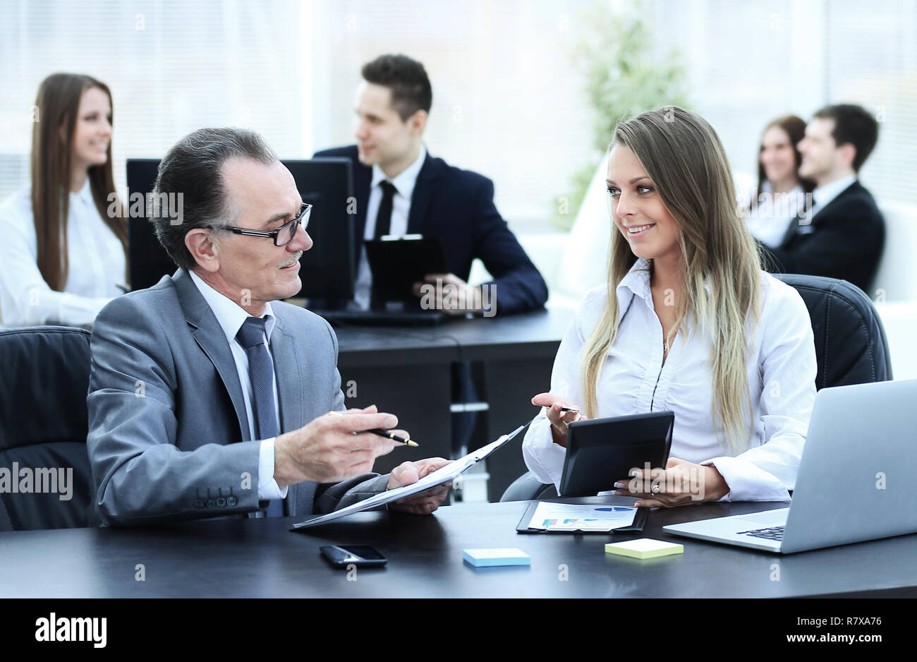 Employees using digital tablet hi-res stock photography and images - Alamy