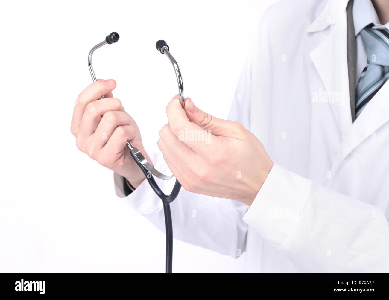 closeup. medical practitioner holding a stethoscope. isolated on a ...