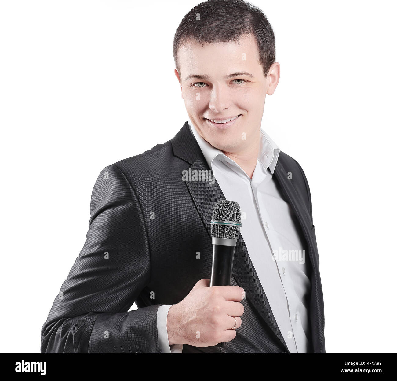 young speaker with a microphone.isolated on white background Stock ...