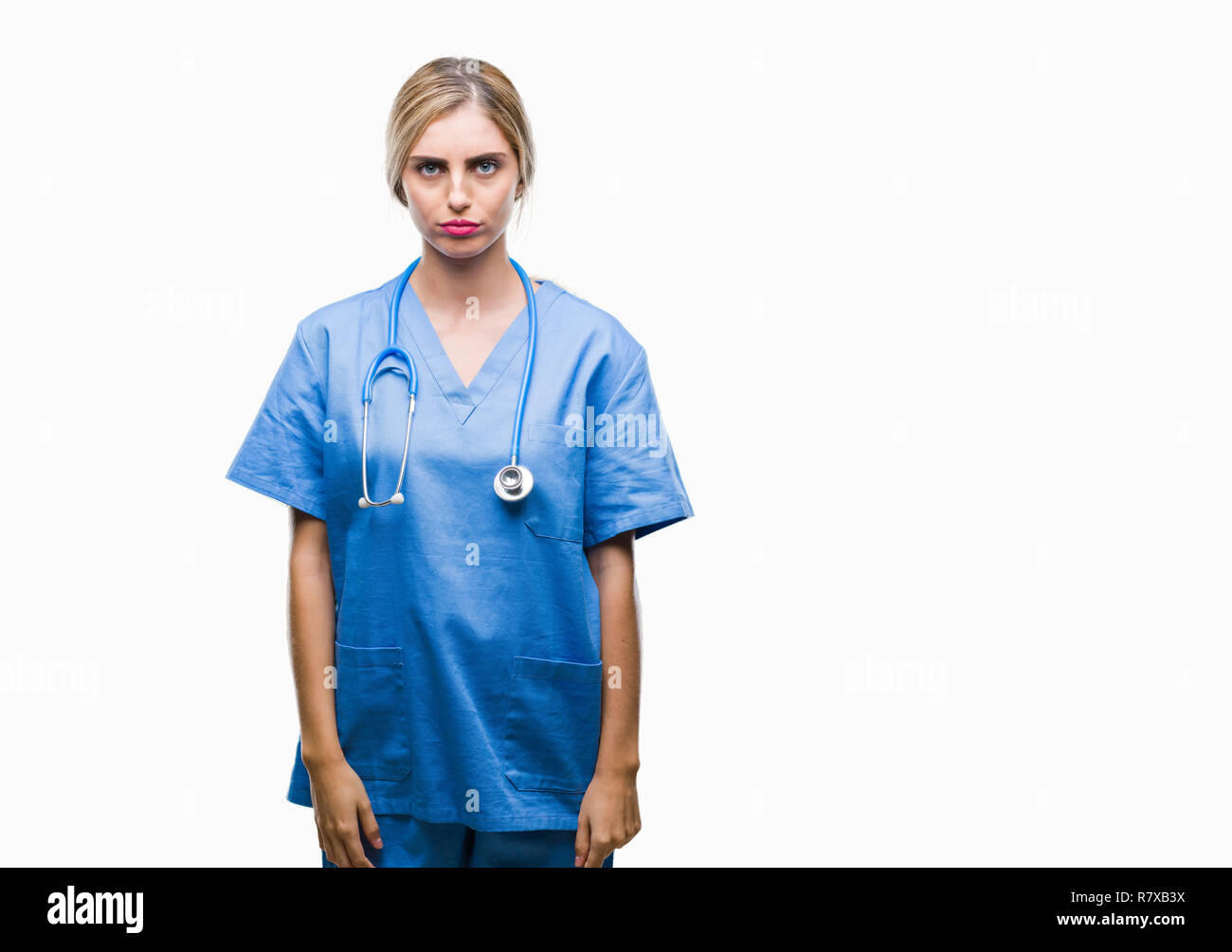 Young beautiful blonde doctor surgeon nurse woman over isolated ...