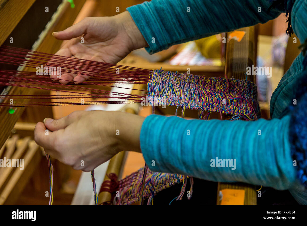 Woman Working in a Weaving Loom, In a Workshop Stock Photo - Alamy