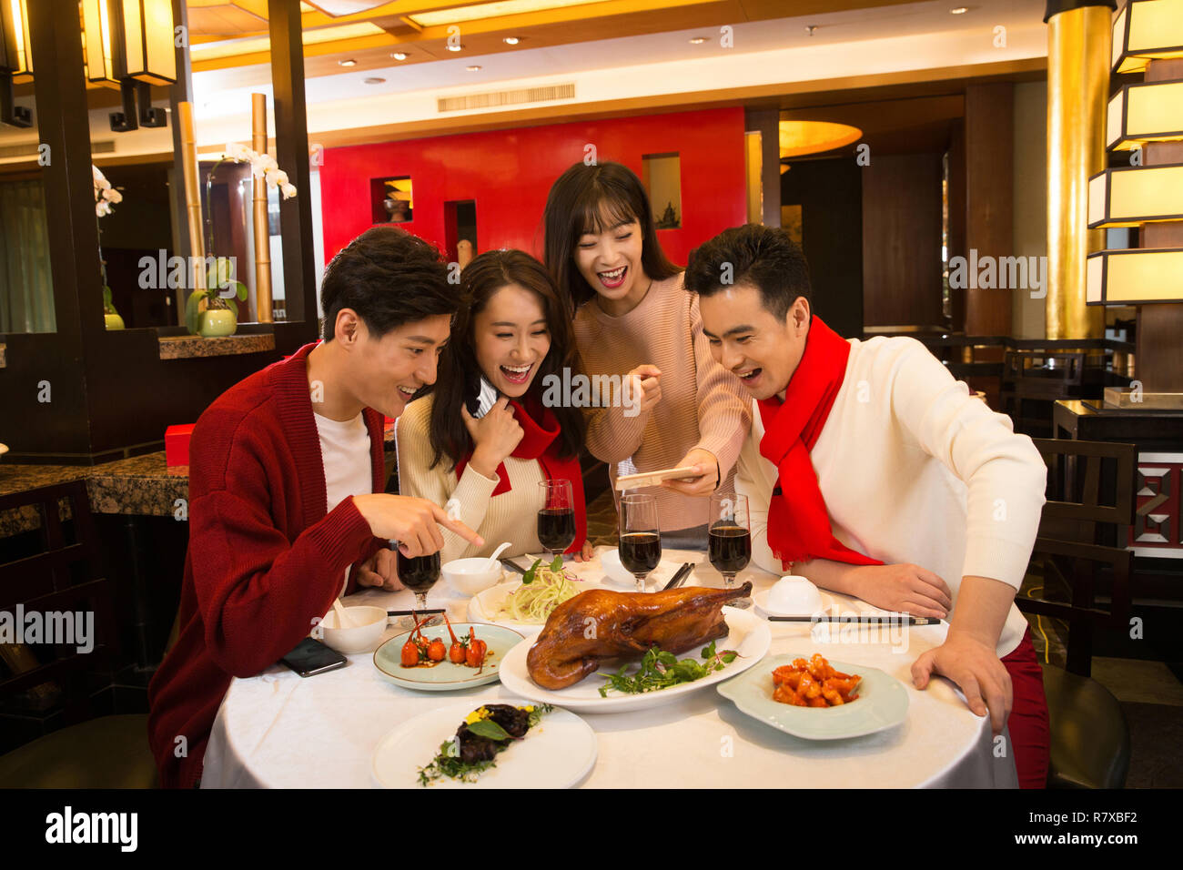 Young people in the restaurant for dinner Stock Photo - Alamy