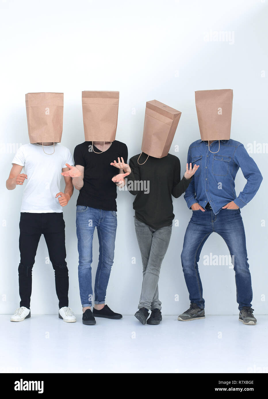 group of young people with paper bags on their heads Stock Photo - Alamy