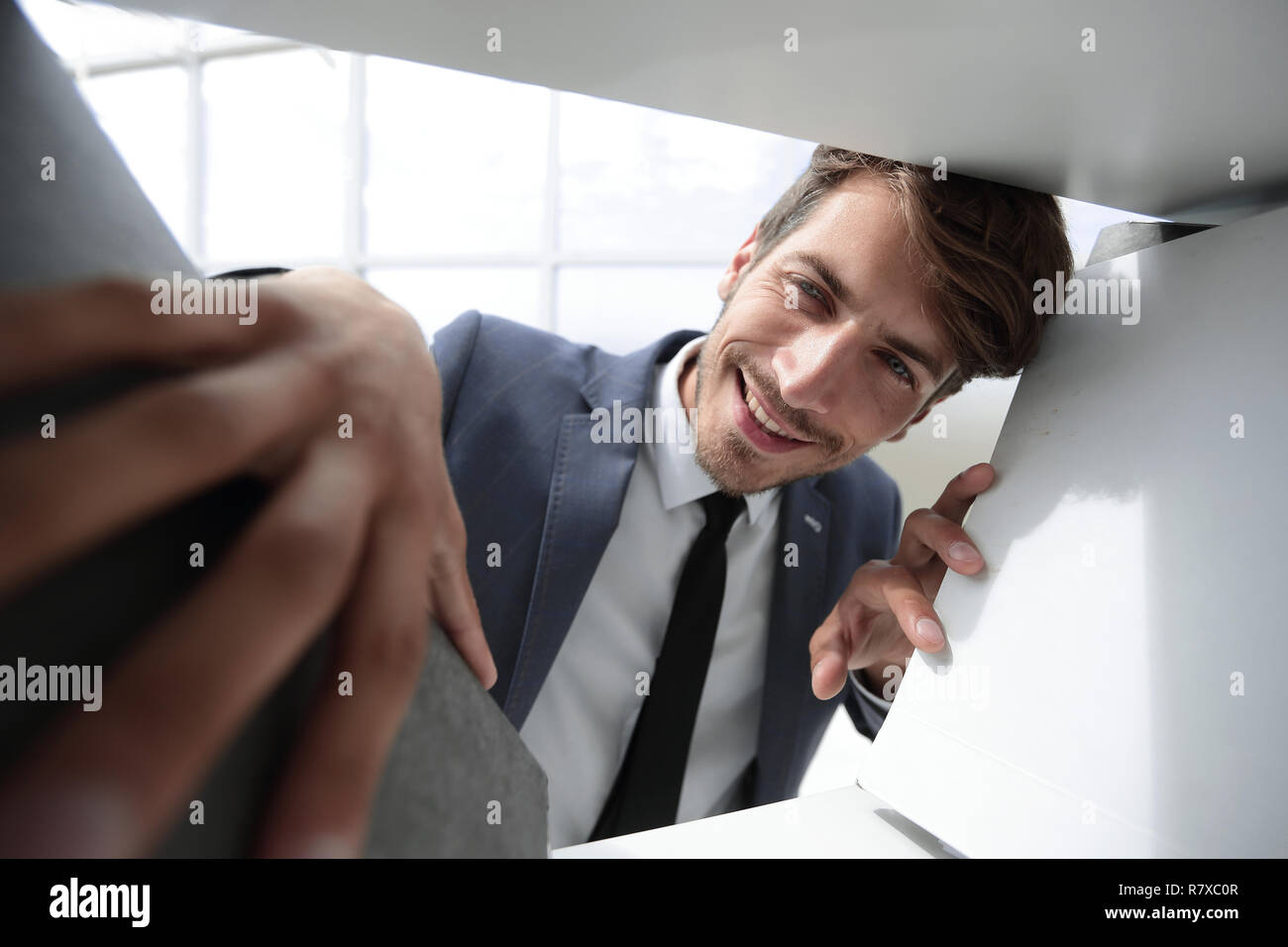 young man takes his hands folder Stock Photo - Alamy