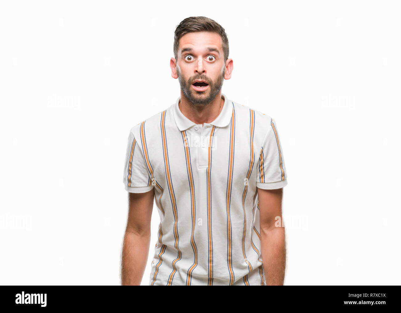 Young handsome man over isolated background afraid and shocked with ...