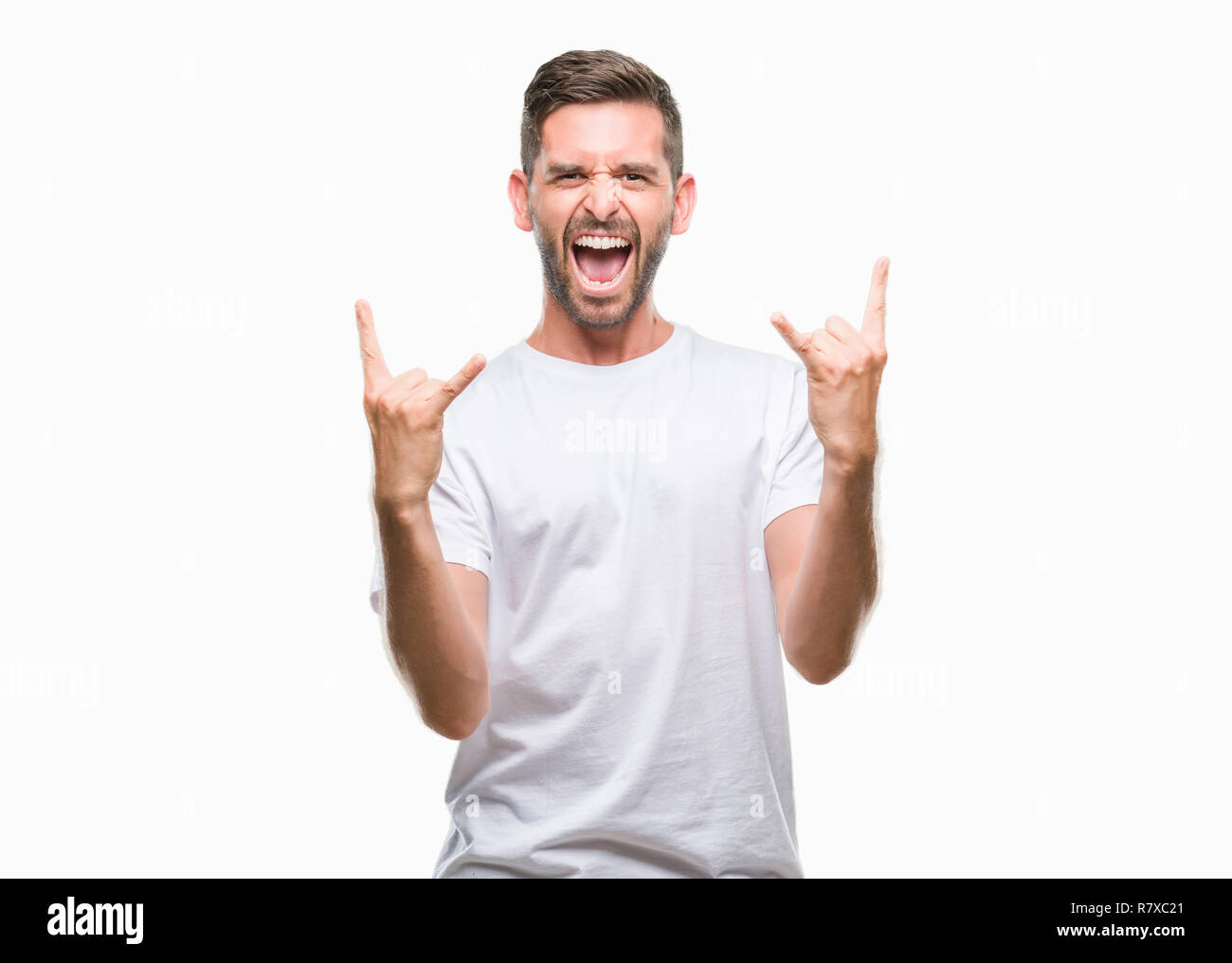 Young handsome man over isolated background shouting with crazy ...