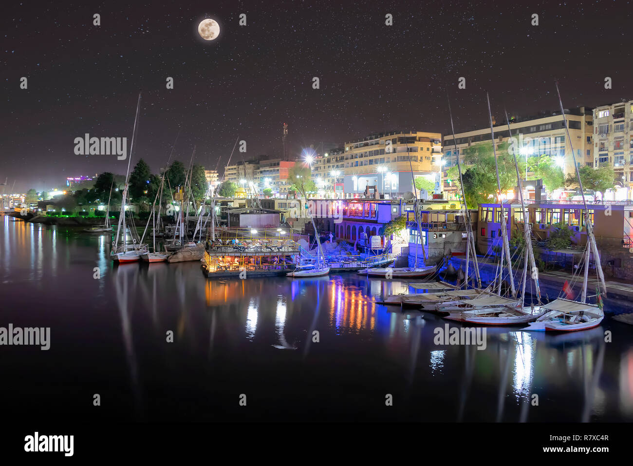 View of Aswan at night with full moon in starry sky Stock Photo - Alamy