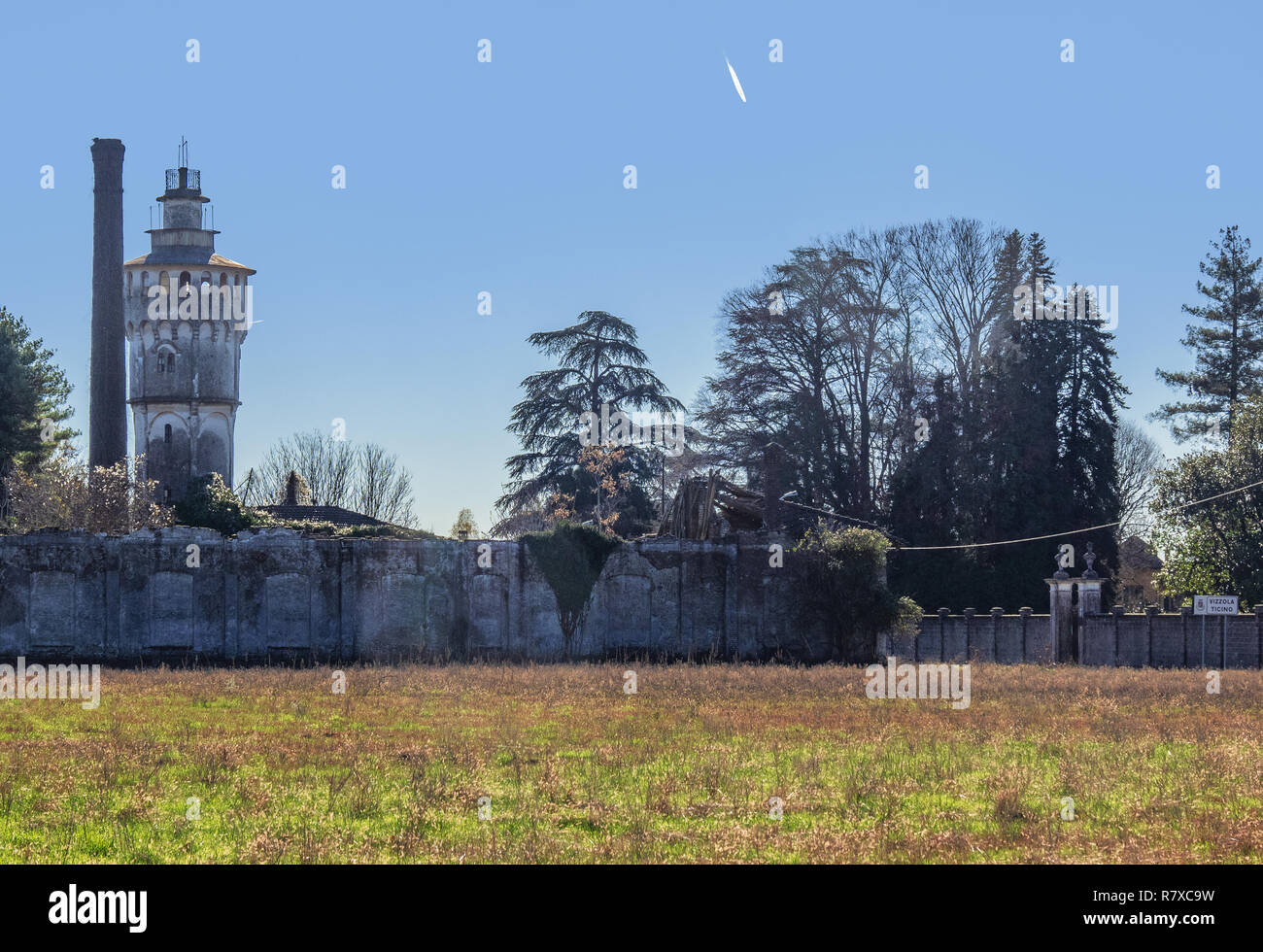 old factory in the Ticino park with a Lombard style tower and brick ...
