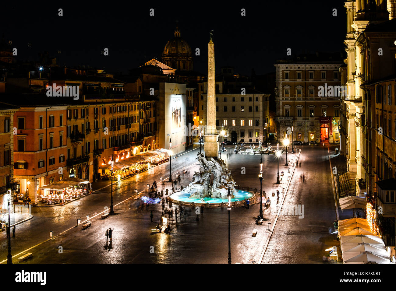 View from a window overlooking Piazza Navona at night showing the ...