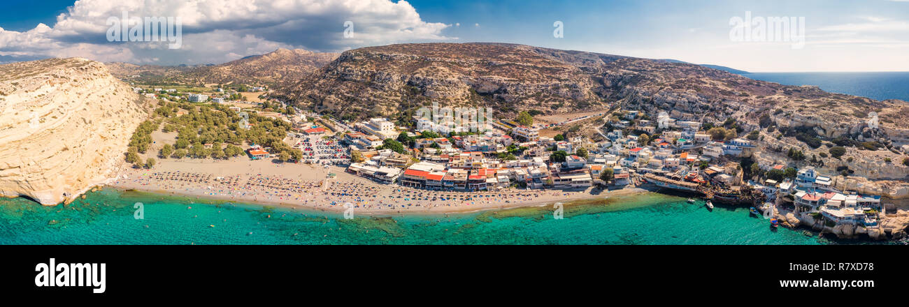 Aerial view of Matala beach on Crete island with azure clear water ...