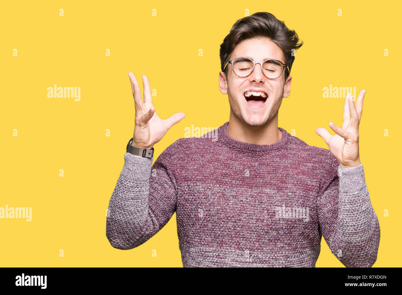Young Handsome Man Wearing Glasses Over Isolated Background Celebrating