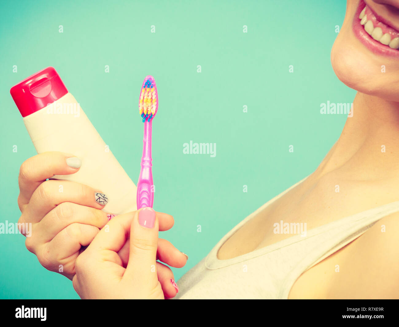Woman holding brush and tooth paste for teeth cleaning. Happy smiling ...