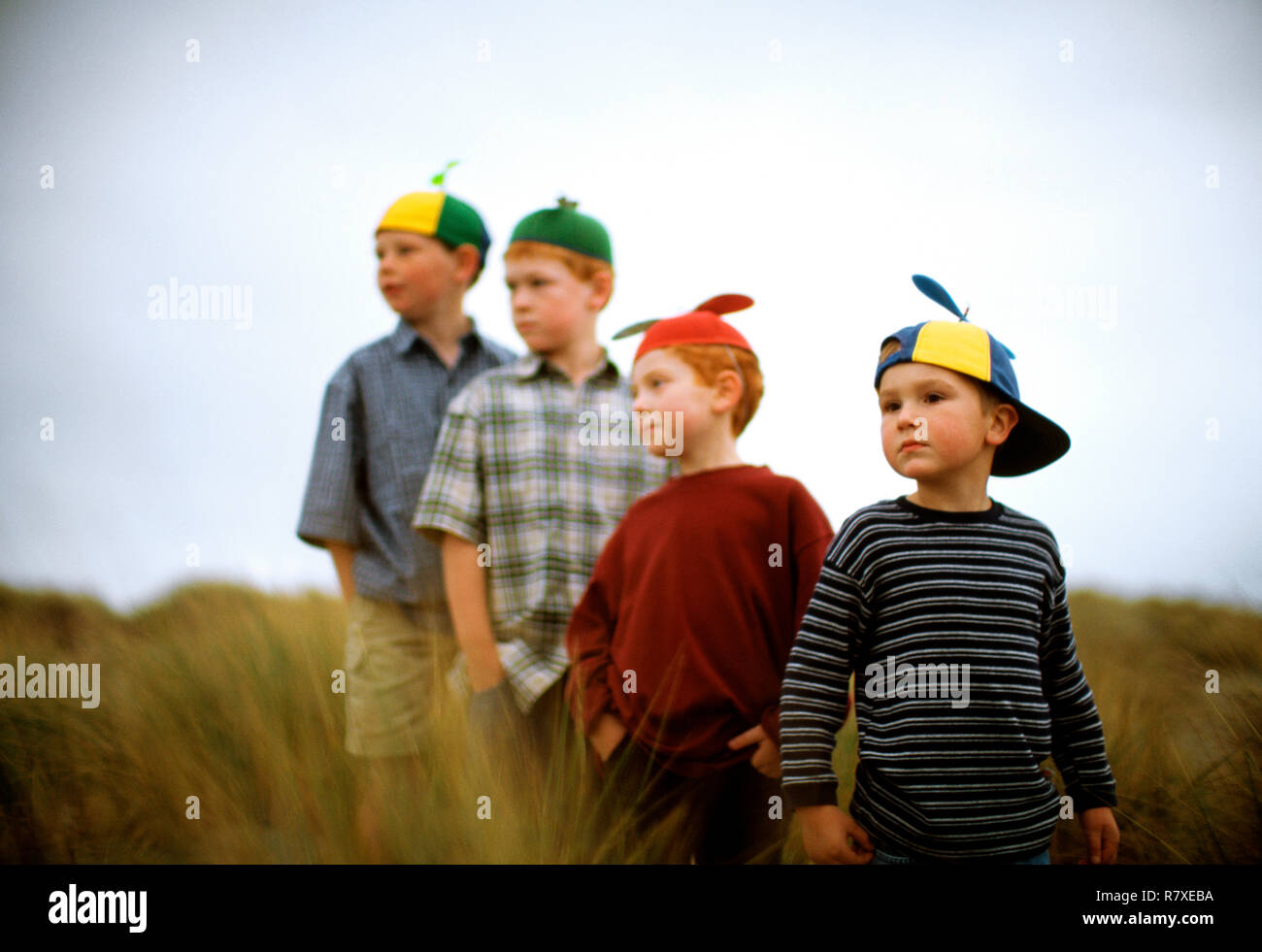 Boys wearing hats standing in line Stock Photo - Alamy