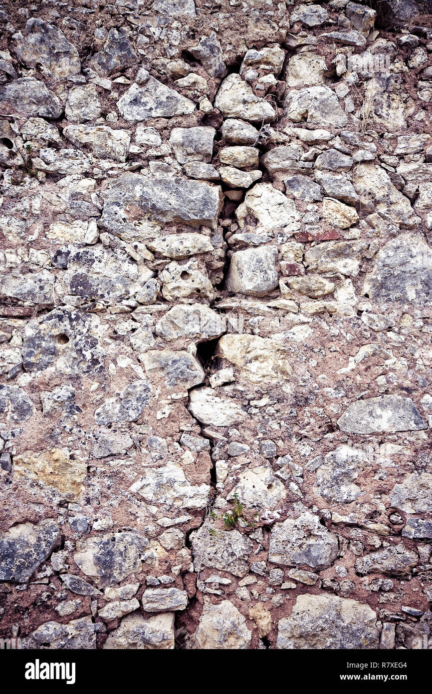 Deep crack in old stone wall - concept image Stock Photo - Alamy