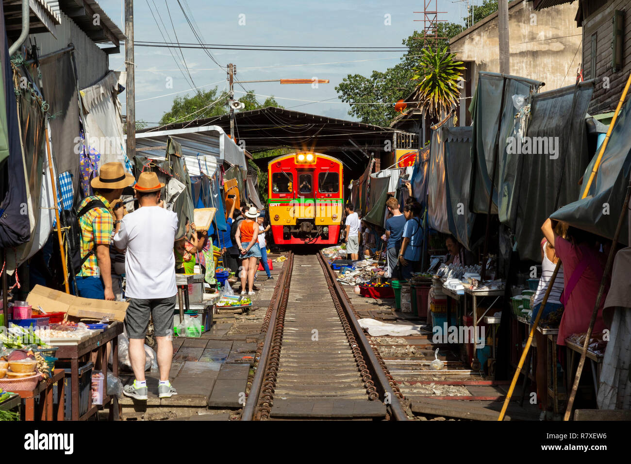 The Mae Klong Railway Market, or Bangkok Train Market, is a strange ...