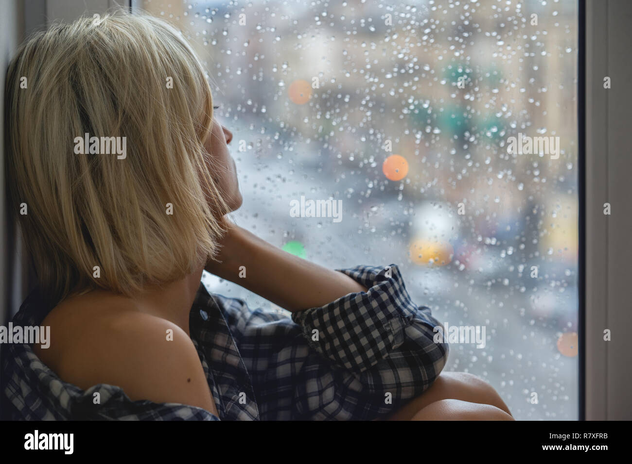 Woman sad window rain hi-res stock photography and images - Alamy