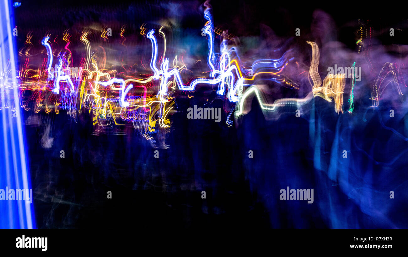 Long Exposure People Of People In Fairground Stock Photo - Alamy