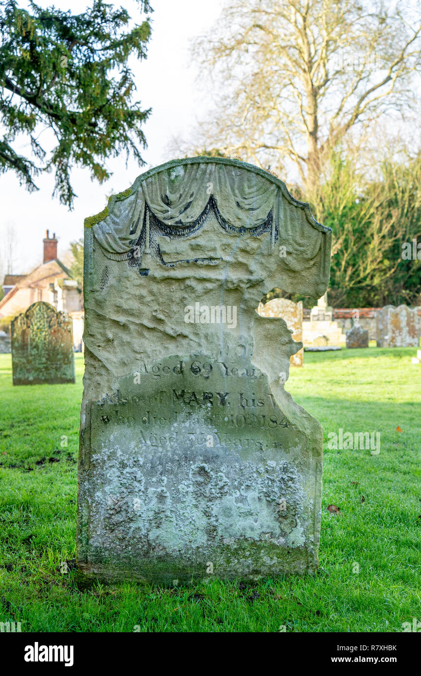 Old gravestone showing extreme erosion Stock Photo - Alamy