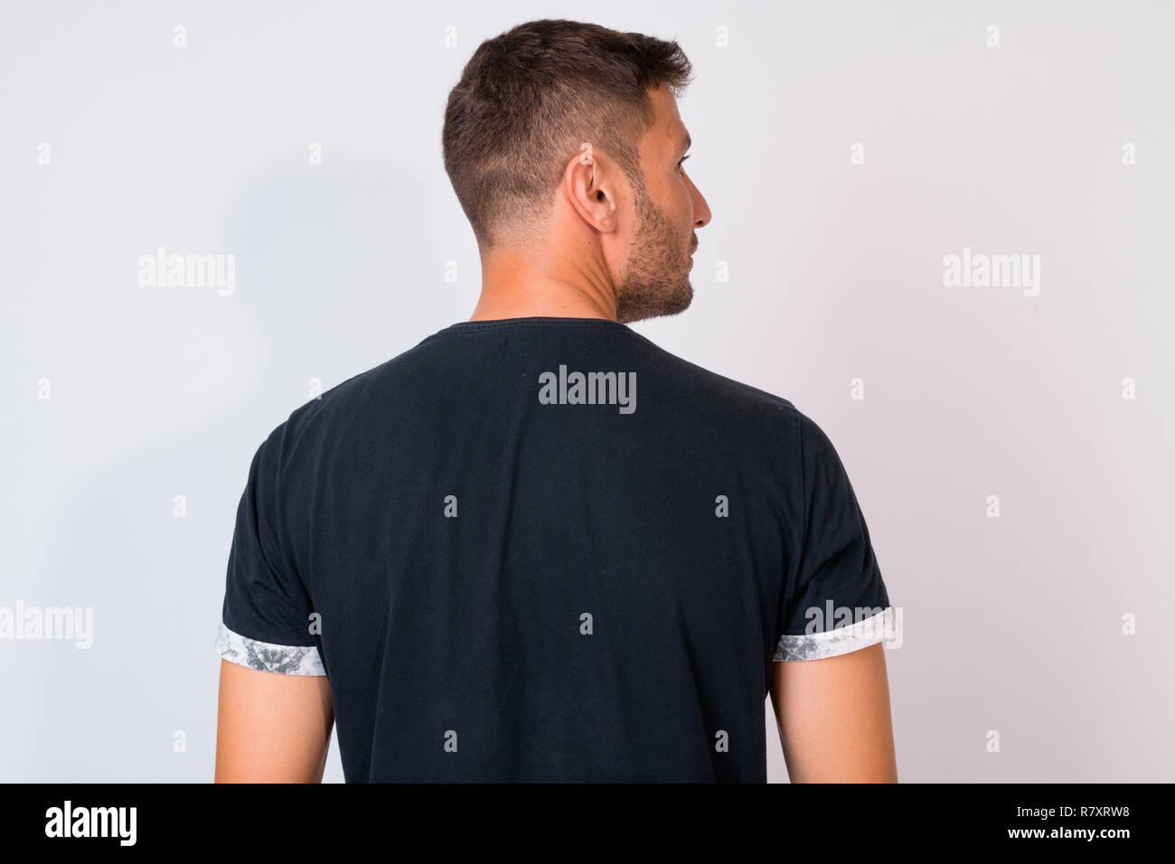 Rear view of bearded Persian man against white background Stock Photo ...