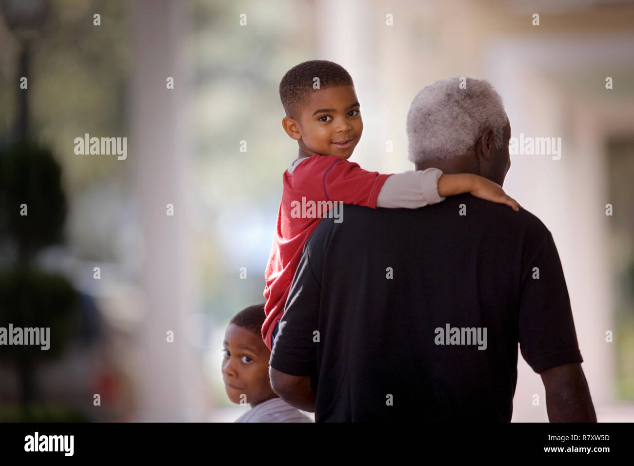 Child Being Carried By A Man High Resolution Stock Photography and ...